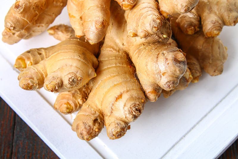 Spicy Root of Ginger on a Wooden Table. Stock Photo - Image of wooden ...