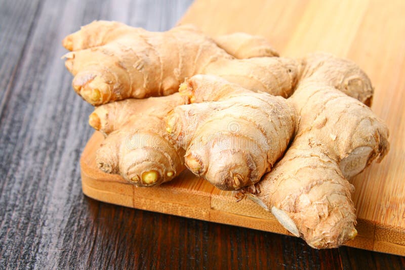 Spicy Root of Ginger on a Wooden Table. Stock Photo - Image of health ...