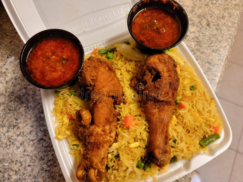 Spicy Sauce and Fried Rice and Chicken from Ghana Stock Image - Image ...