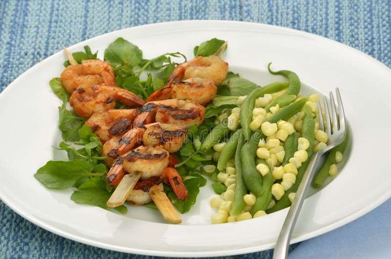 Spicy Shrimp Skewers with Beans and Corn Stock Photo - Image of seafood ...