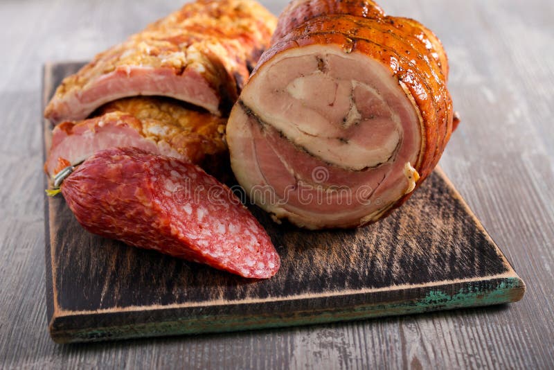 Spicy Smoked Pork Roll and Ribs Stock Photo - Image of smoke, bacon ...