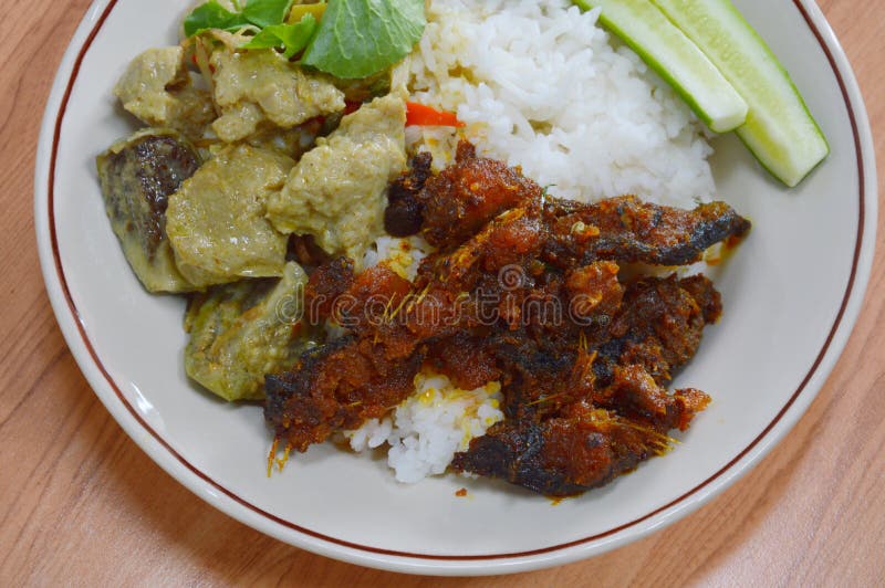 Spicy Stir-fried Catfish and Curry Fish Ball on Rice Stock Image ...