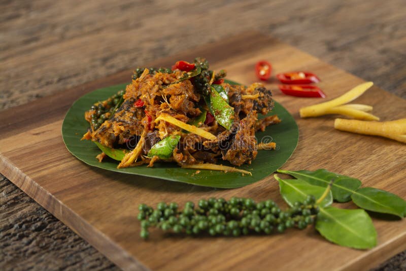 Spicy Stir Fried Smoke-grilled Fish on Chopping Block Stock Photo ...