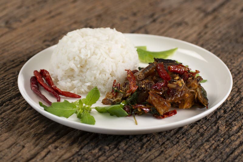 Spicy Stir Fried Smoke-grilled Fish on White Plate Stock Image - Image ...