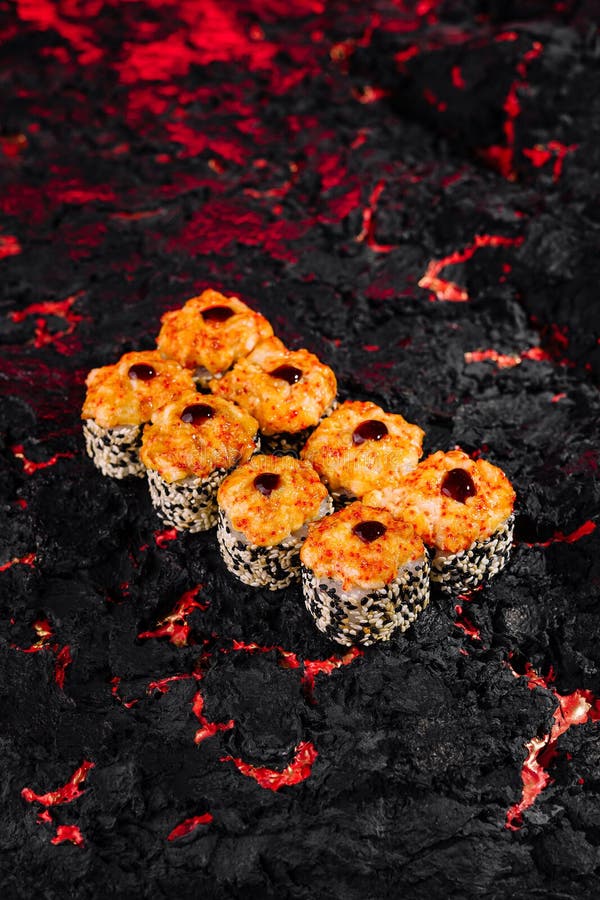 Spicy Volcano Sushi Roll on Lava Textured Background Stock Image ...