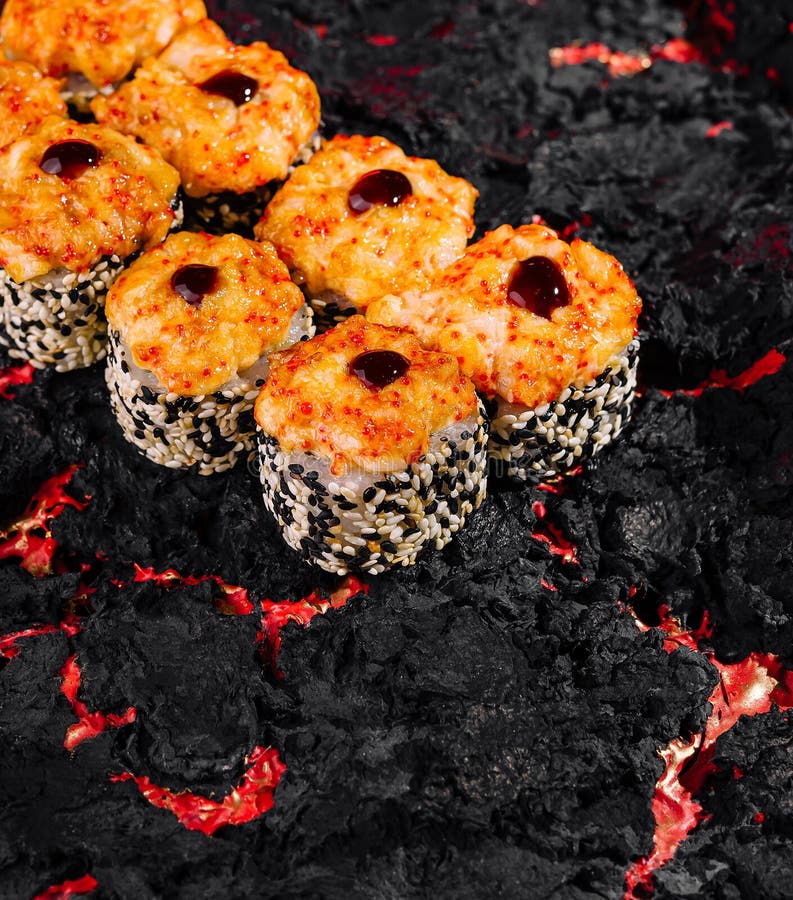 Spicy Volcano Sushi Roll on Lava Textured Background Stock Photo ...
