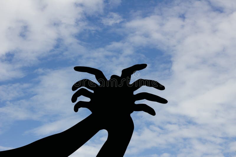 Spider Shape Hand Silhouette in Blue Sky. Stock Photo - Image of shadow ...