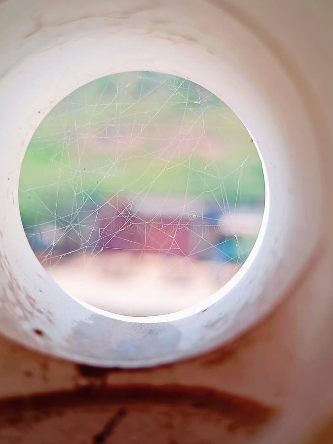 Spider web in empty pipe stock photo. Image of empty - 268252088