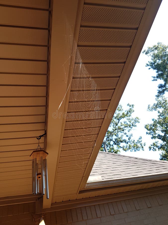 Spider Web Hanging from Roof Stock Image - Image of chime, roof: 189029761