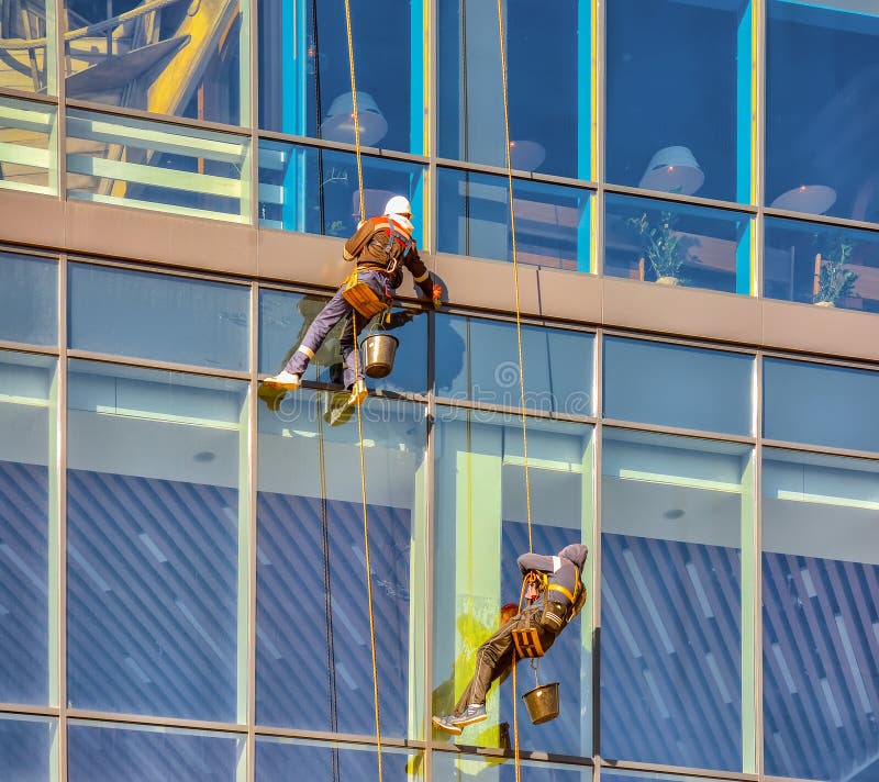 A Man Cleaning Windows On A High Rise Building Editorial Photo - Image ...
