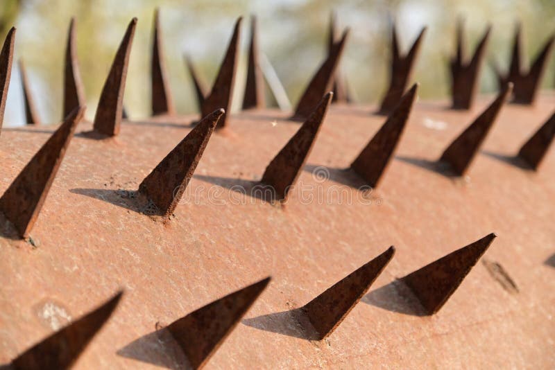 Red Metal Spike With Black Tip Abstract Close Up View With Concrete ...