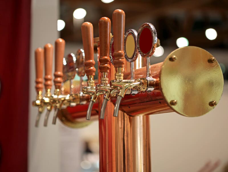 Spiles for Dispensing of Draft Beer in a Night Pubs Stock Image - Image ...