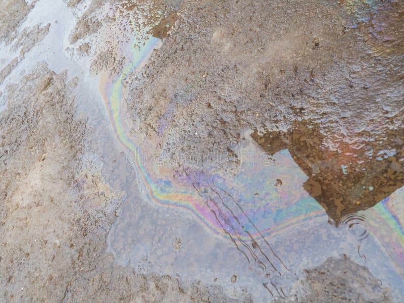 Spill of Petrol in the Road Puddle. Gasoline Footprint Rainbow on the ...