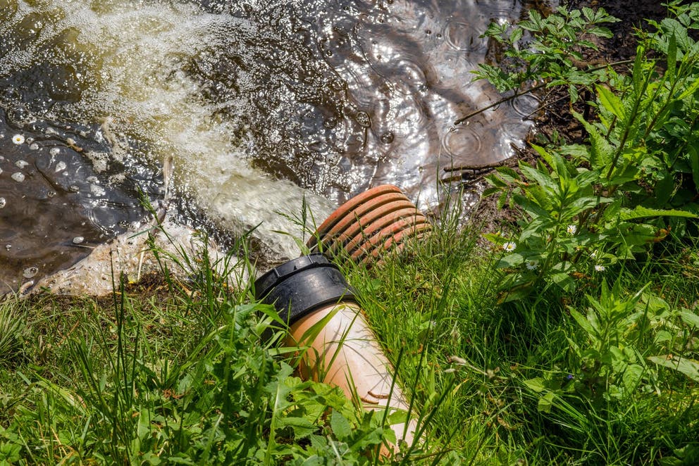 Spill water in a lake stock image. Image of piping, leak - 55970833