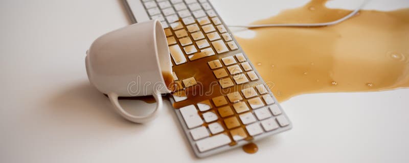 Spilled Black Coffee on a Computer Keyboard at a White Table Stock ...