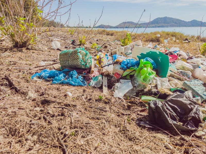 Spilled Garbage on the Beach. Empty Used Plastic, Boxes and Ropes ...
