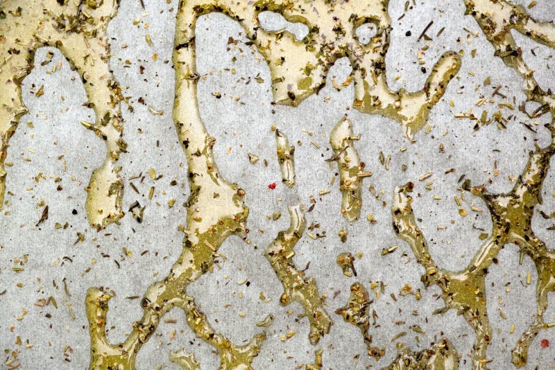 Spilled Gold Olive Oil with Spices on Backing Paper Stock Image - Image ...