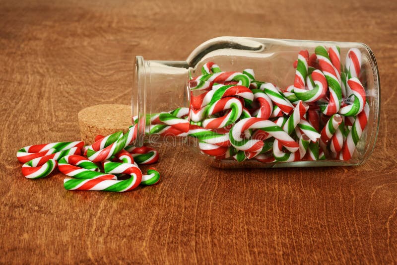 Spilled jar of candy canes stock photo. Image of confectionery - 80895912