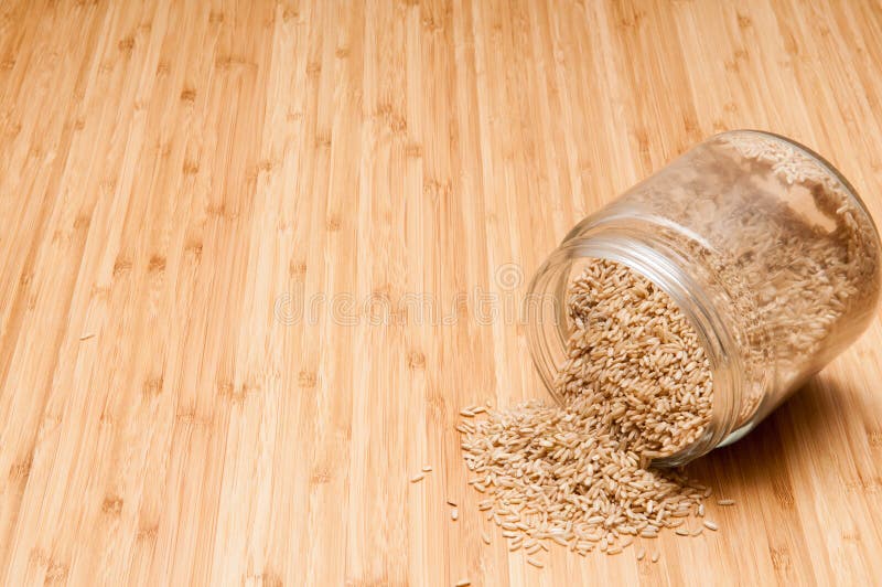Spilled jar of rice stock image. Image of organic, hunger - 65793409