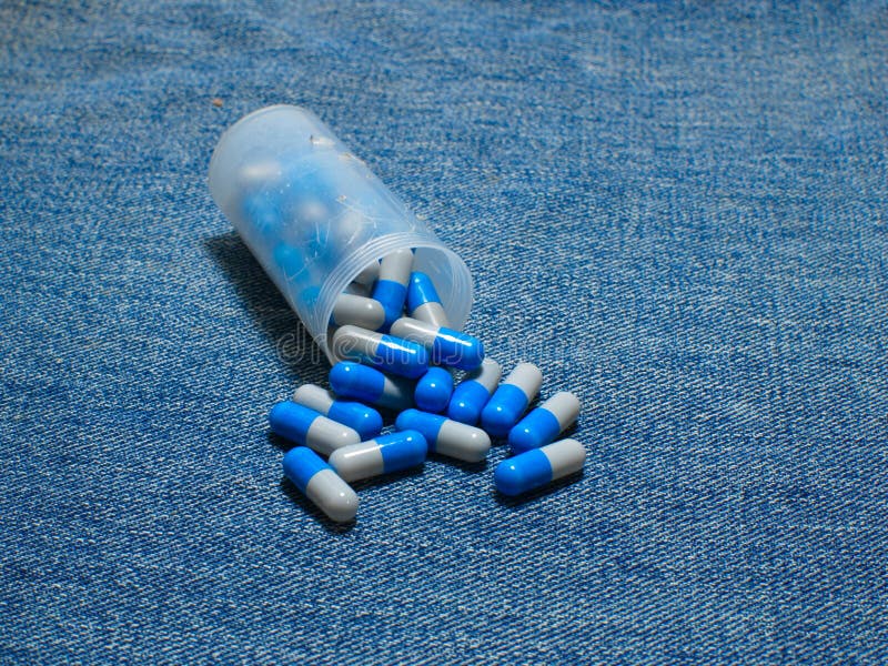 Spilled pills on the table stock image. Image of health - 122385471
