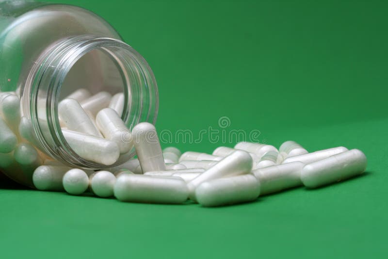Spilled White Capsulesfrom Prescription Bottle Stock Image - Image of ...