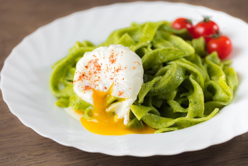 Spinach Pasta with Poached Egg Stock Photo - Image of view, cherry ...