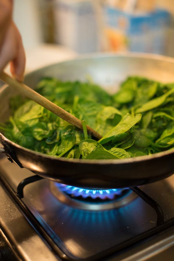 Spinach in a Pot with Lit Fire Stock Photo - Image of healthy, view ...