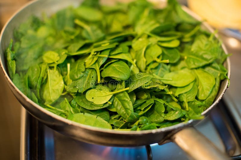 Spinach in a Pot with Lit Fire Stock Photo - Image of fresh, fire ...