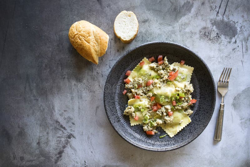 Spinach Ricotta Ravioli with Sausage and Tomatoes Stock Image - Image ...
