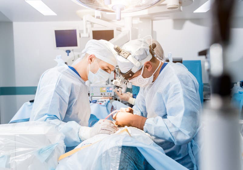Spinal Surgery. Group of Surgeons in Operating Room Stock Photo - Image ... Spinal Surgery. Group of Surgeons in Operating Room Stock Photo - Image ...