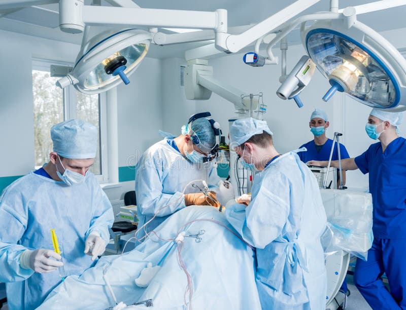 Spinal Surgery. Group of Surgeons in Operating Room with Surgery ...