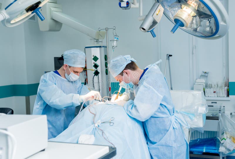 Spinal Surgery. Group of Surgeons in Operating Room with Surgery ...