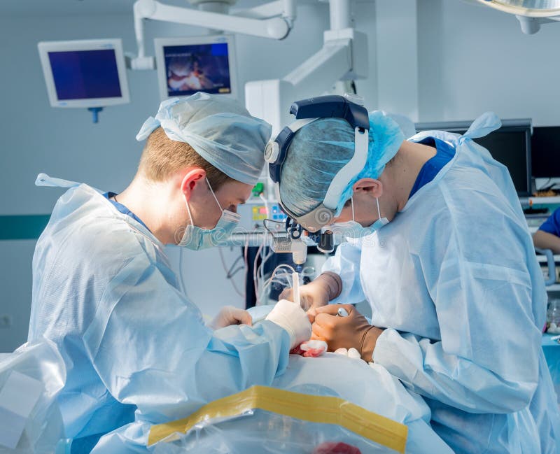 Spinal Surgery. Group of Surgeons in Operating Room with Surgery ...