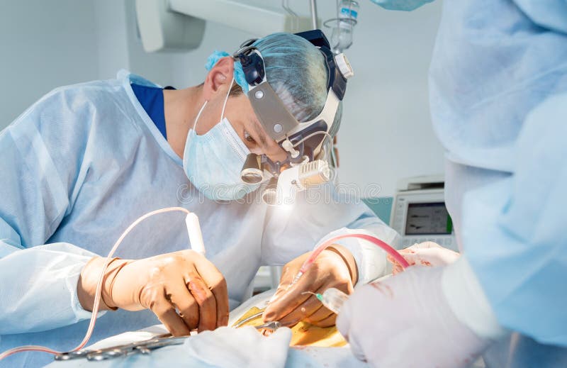 Spinal Surgery. Group of Surgeons in Operating Room with Surgery ...