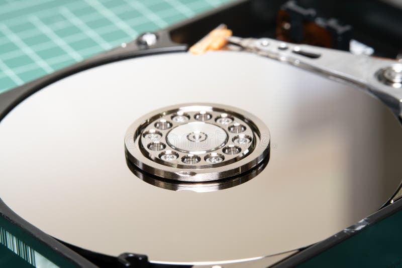 Spindle with Plate and Actuator Arm Opened Hard Disk Drive HDD. : Macro ... Spindle with Plate and Actuator Arm Opened Hard Disk Drive HDD. : Macro ...