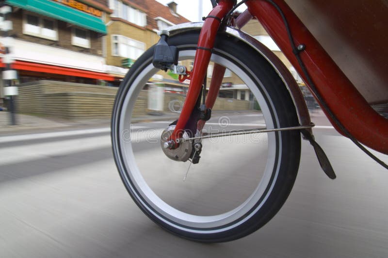 Spinning bicycle wheel stock photo. Image of traffic, cars - 4641742
