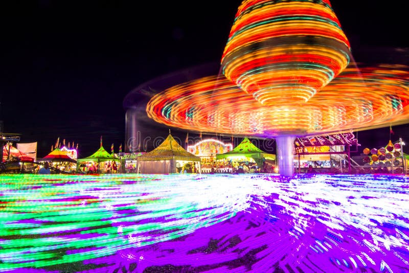 Spinning Fair Ride Lights stock photo. Image of moving - 30976170