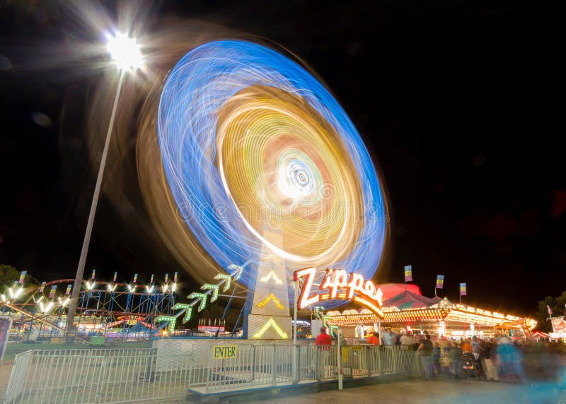 Spinning Ride At County Fair Stock Photo - Image of arms, amusment ...