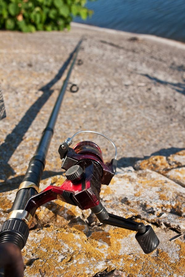 Spinning rod, close-up stock image. Image of reel, lake - 10771045