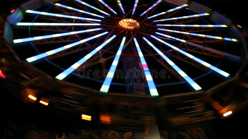 Spinning Wheel in Amusement Park Stock Video - Video of lights, rotate ...