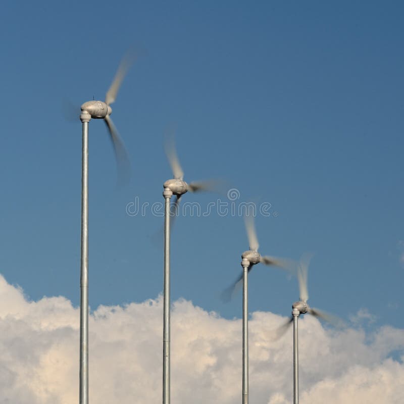 Spinning wind turbines stock photo. Image of technology - 16635700