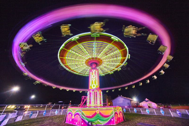 Spinning YOYO Ride with Purple Ring at a Fair or Carnival Editorial ...
