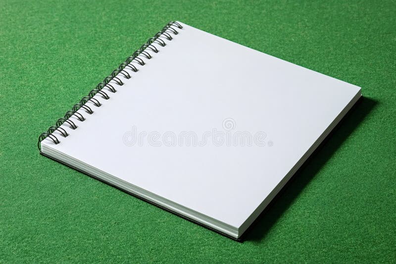Spiral-bound Sketchbook on Green Surface Ready for Creativity Stock ...