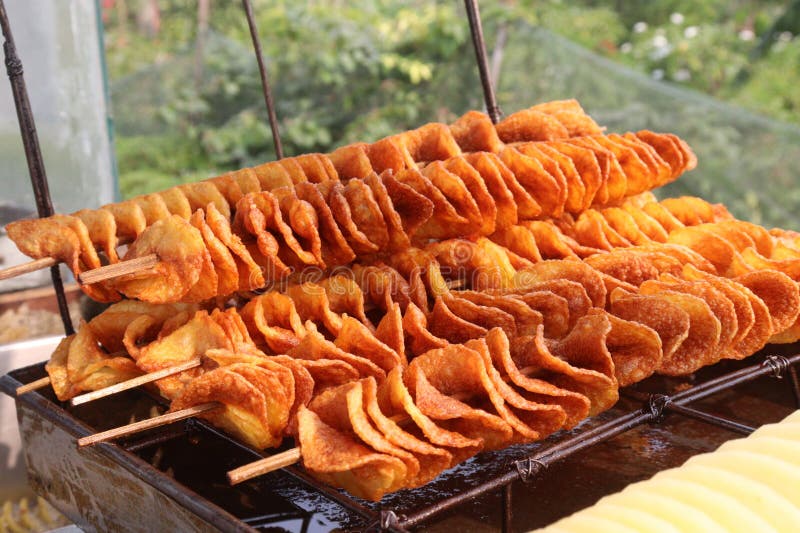 Spiral Fried Potato with Stick on Shop Stock Photo - Image of british ...