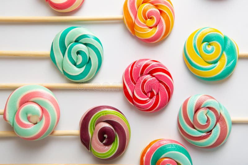 Spiral Lolly Pops Candy on Sticks on Light Surface Stock Image - Image ...