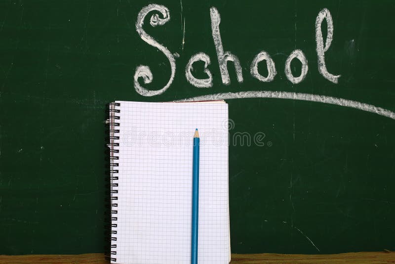 Spiral Notebook in Front of the Chalkboard Stock Image - Image of ...