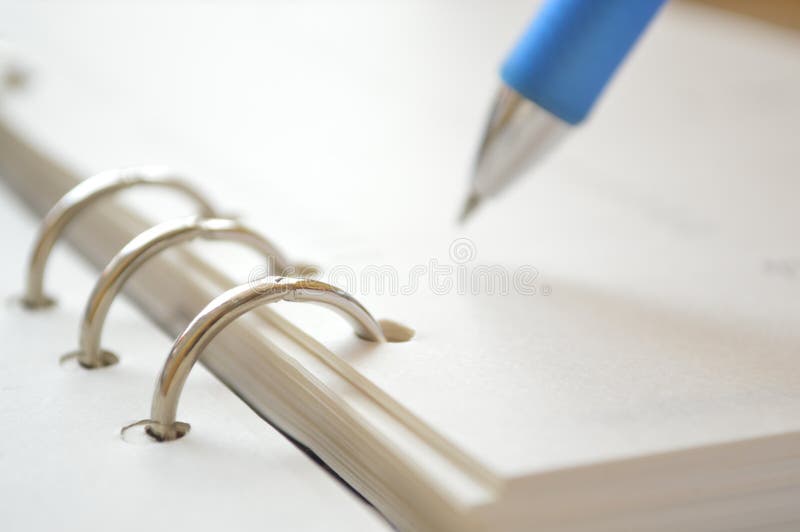 Spiral notebook and pen stock photo. Image of business - 46741224