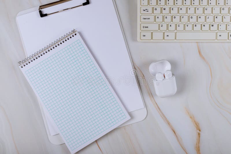 Spiral Notepad Over Pack Paper on a Wireless Headphones, Computer ...