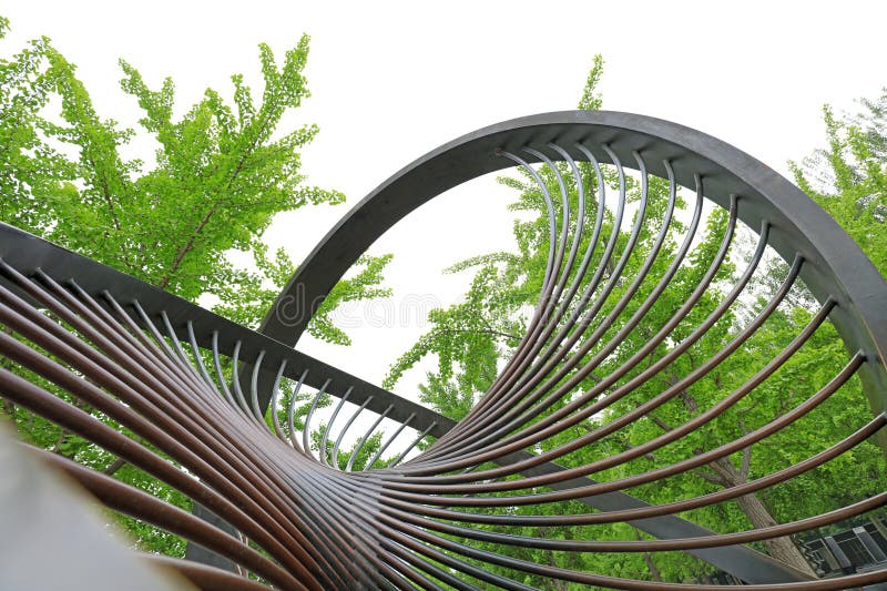 Spiral Sculpture in Green Trees Stock Photo - Image of landscape, spoke ...