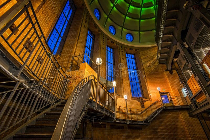 A Spiral Staircase in a Large Building with Blue Windows Editorial ...